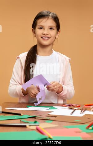 happy children cutting colored papers with scissors Stock Photo - Alamy