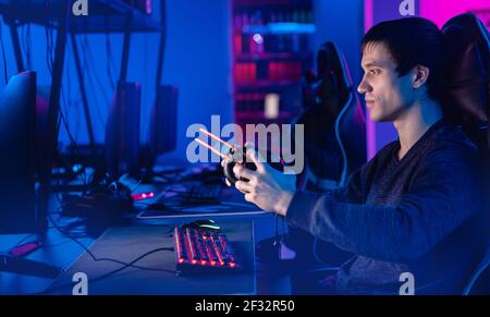 Streamer professional cyber sport gamer playing online computer game ...