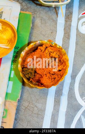 Indian Hindu bride with turmeric paste applied on her face having fun ...