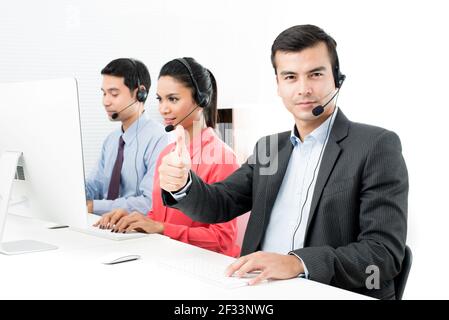 Man agent operator with headset giving support. At a modern office ...