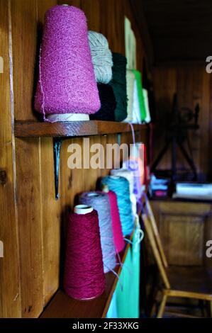 Spools of colorful threads on old wooden table Stock Photo - Alamy
