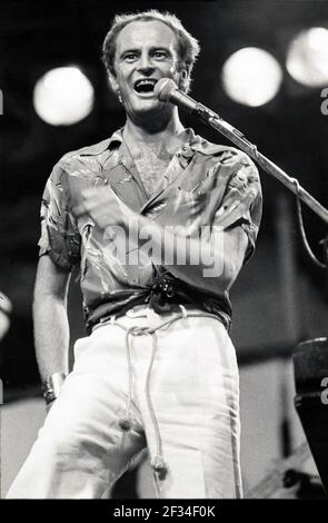 Singer, songwriter and performer Peter Allen on stage in Central Park ...