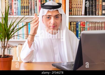 Aarabic muslim man using online technology Stock Photo - Alamy