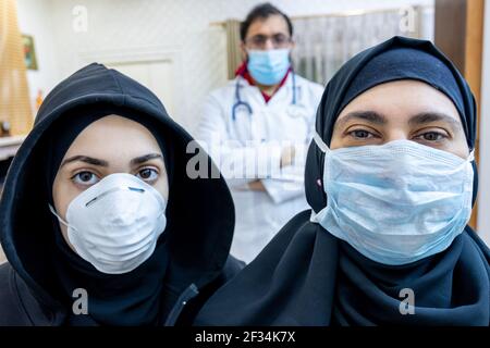 Arabic Muslim family wearing masks Stock Photo - Alamy