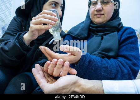 Arabic Muslim family using hygiene products Stock Photo - Alamy