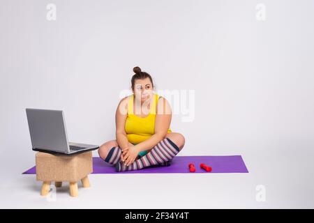 Sad Obese Woman Training in Gym Stock Photo - Alamy