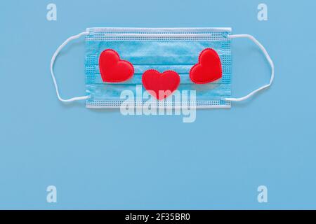 Doctors with red hearts on blue background with space for text. Banner ...