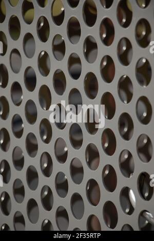 A vertical shot of circle patterned steel fence Stock Photo - Alamy