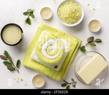 Beautiful spa composition with candles, soap and bathing accessories on ...