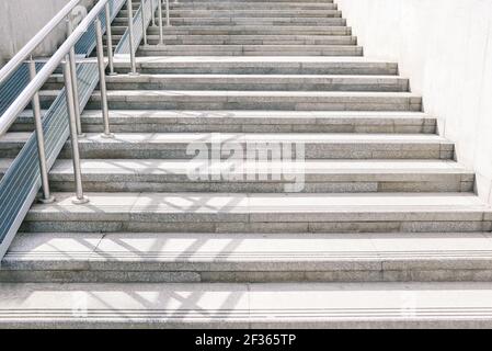 Gray staircase with a ramp for the disabled. Urban architecture. Exit ...