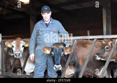 Robert Hunter, dairy farmer with his cows, Tarbrax Farm, Shotts ...
