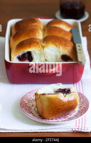 Austrian buns with cherry filling in a baking dish. Rustic style Stock ...