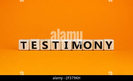 Testimony symbol. Wooden cubes with the word 'testimony' behind yellow ...