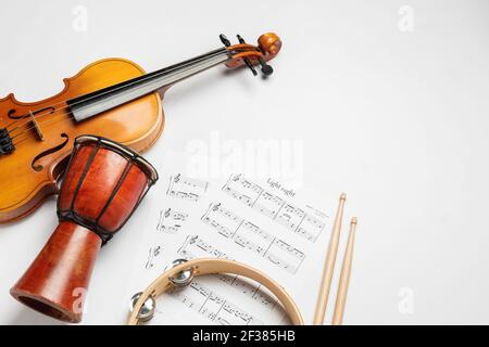 Different musical instruments and music notes on white background Stock ...