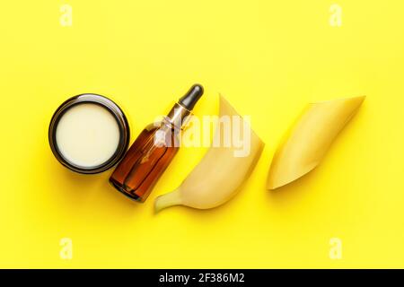Natural banana cosmetics on color background Stock Photo - Alamy