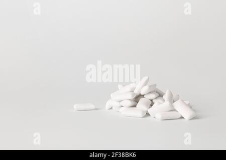 Tasty chewing gums on light background Stock Photo - Alamy