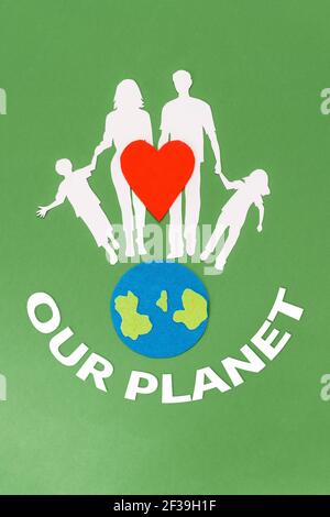 paper family on the earth planet. family and peace concept Stock Photo ...
