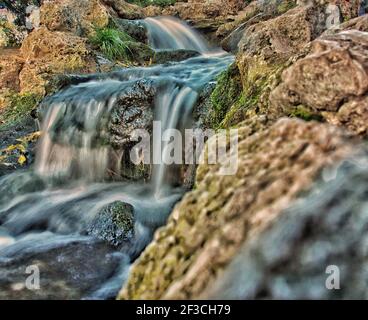 A mesmerizing shot of a waterfall with the blurred foreground in Vienna ...