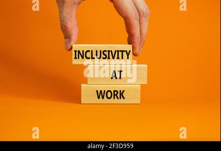 Inclusivity at work symbol. Wooden blocks with words 'Inclusivity at ...