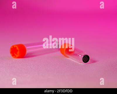 2D barcoded tubes for biological sample storage. Jacketed in foreground ...