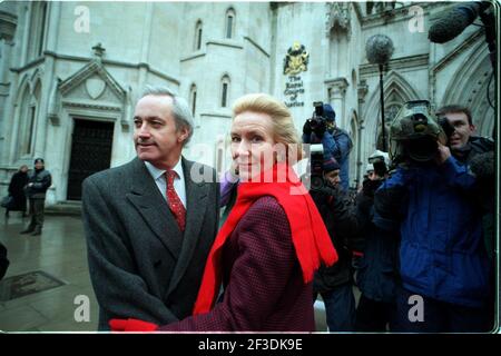 Neil Hamilton arriving at the High Court with wife Christine where he ...