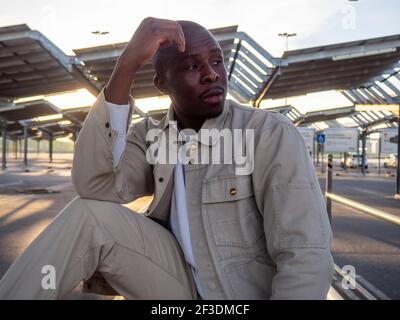 A handsome black Spanish male posing in the parking lot Stock Photo - Alamy