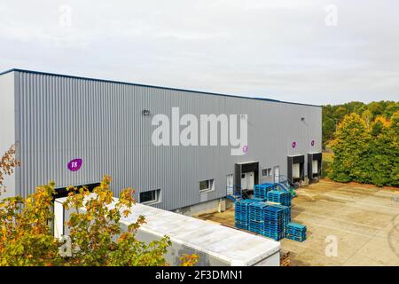 The building of a modern logistics center. Front view of loading docks ...