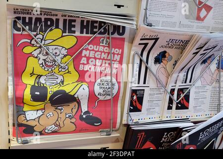 The front page of Charlie Hebdo with Meghan Markle and the Queen ...