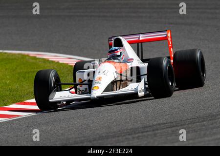 Takuma Sato, of Japan, drives the Auto Nation/Sirius XM (car 51) into ...
