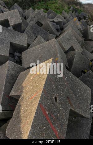 Sea defence blocks placed to stop erosion on the beach at Grain Kent ...