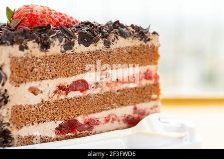 side view chocolate flavor cake with strawberry close up horizontal ...