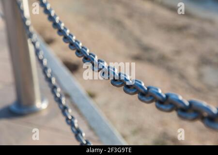Hanging chain between two posts Stock Photo - Alamy