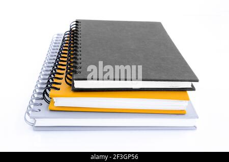 Stack of notebooks (or copybooks) on white background Stock Photo - Alamy