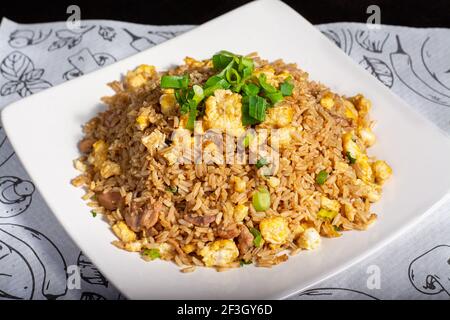 Peruvian traditional food. Rice with meat and vegetable, scramble eggs ...