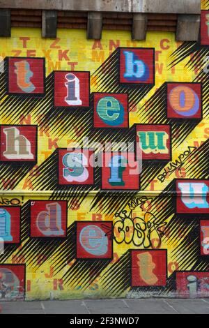 Ben Eine. Street art, a large initial E painted on metal scrolling ...