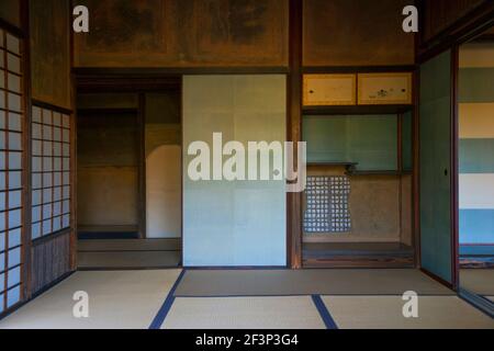 A naturally-lit interior view shows the traditional tatami mat floors ...