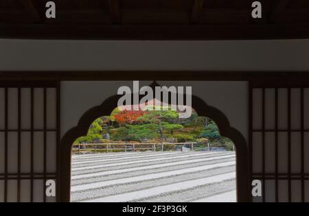 A view through a cusped alcove window shows the courtyard garden of ...