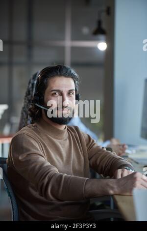 The young man in call center concept working late overtime in office ...