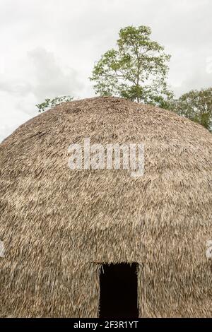 Traditional house made from straw in a village along the Kaladan River ...