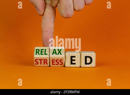 Stressed or relaxed symbol. Businessman turns cubes and changes the ...