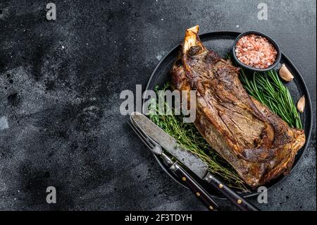 Grilled goat or lamb mutton shoulder meat in a rustic plate with salad ...