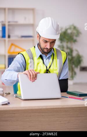 Young arm injured architect working in the office Stock Photo - Alamy