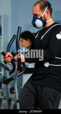 Science sport doctor asking patient about his health while sportsman ...
