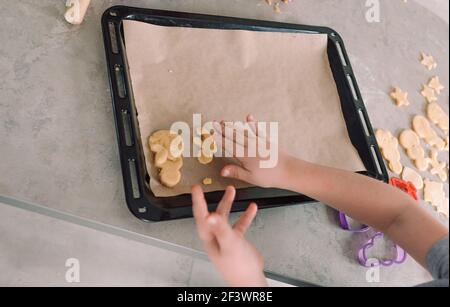 Flat lay. Rolling out sugar cookie dough to bake Christmas cookies ...
