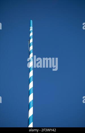 traditional german maypole against blue sky, may day celebration in ...