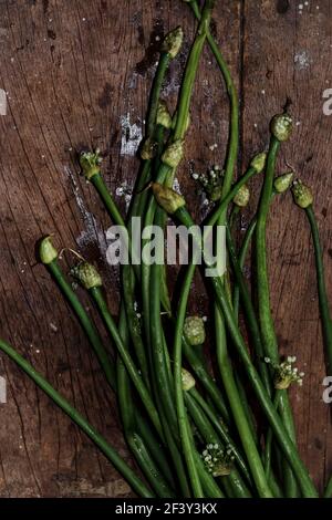 Bunch of green onion. Old rustic wooden table background Stock Photo ...