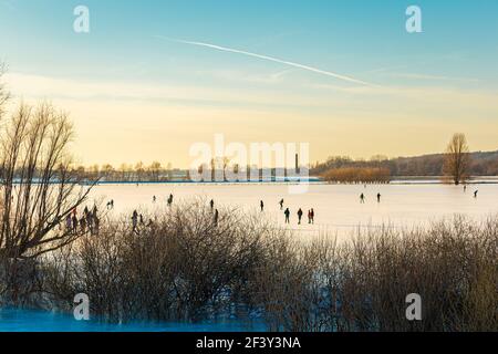 Ice skating on frozen floodplains in the Netherlands Stock Photo - Alamy