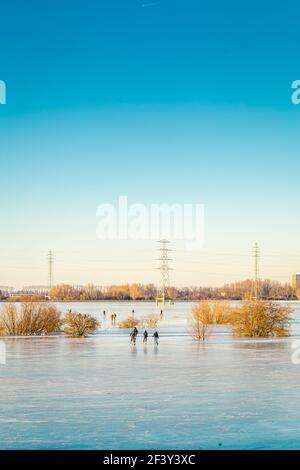 Ice skating on frozen floodplains in the Netherlands Stock Photo - Alamy
