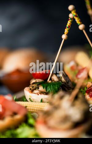 Spanish pinchos: Skewer snacks made of grilled bread with roasted and ...