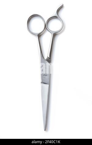 Overhead view of a pair of hairdressers scissors isolated on white ...